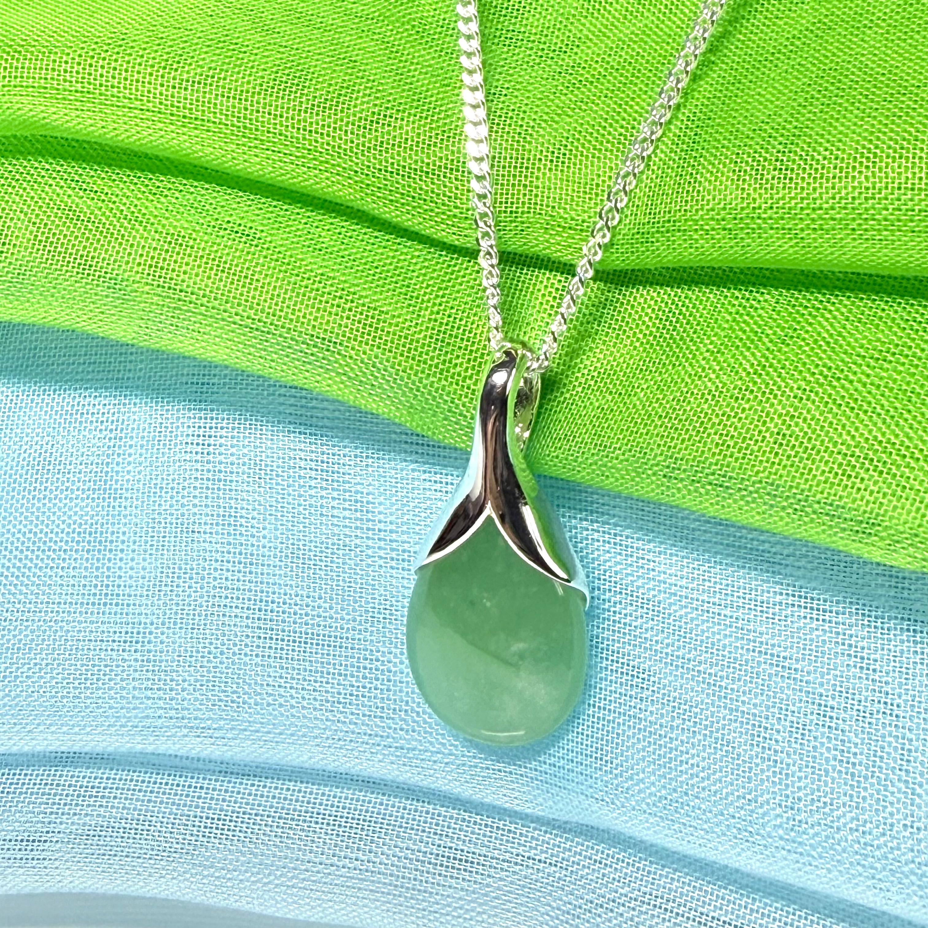 A beautiful real green jade necklace in a teardrop or pear shape, a re ...
