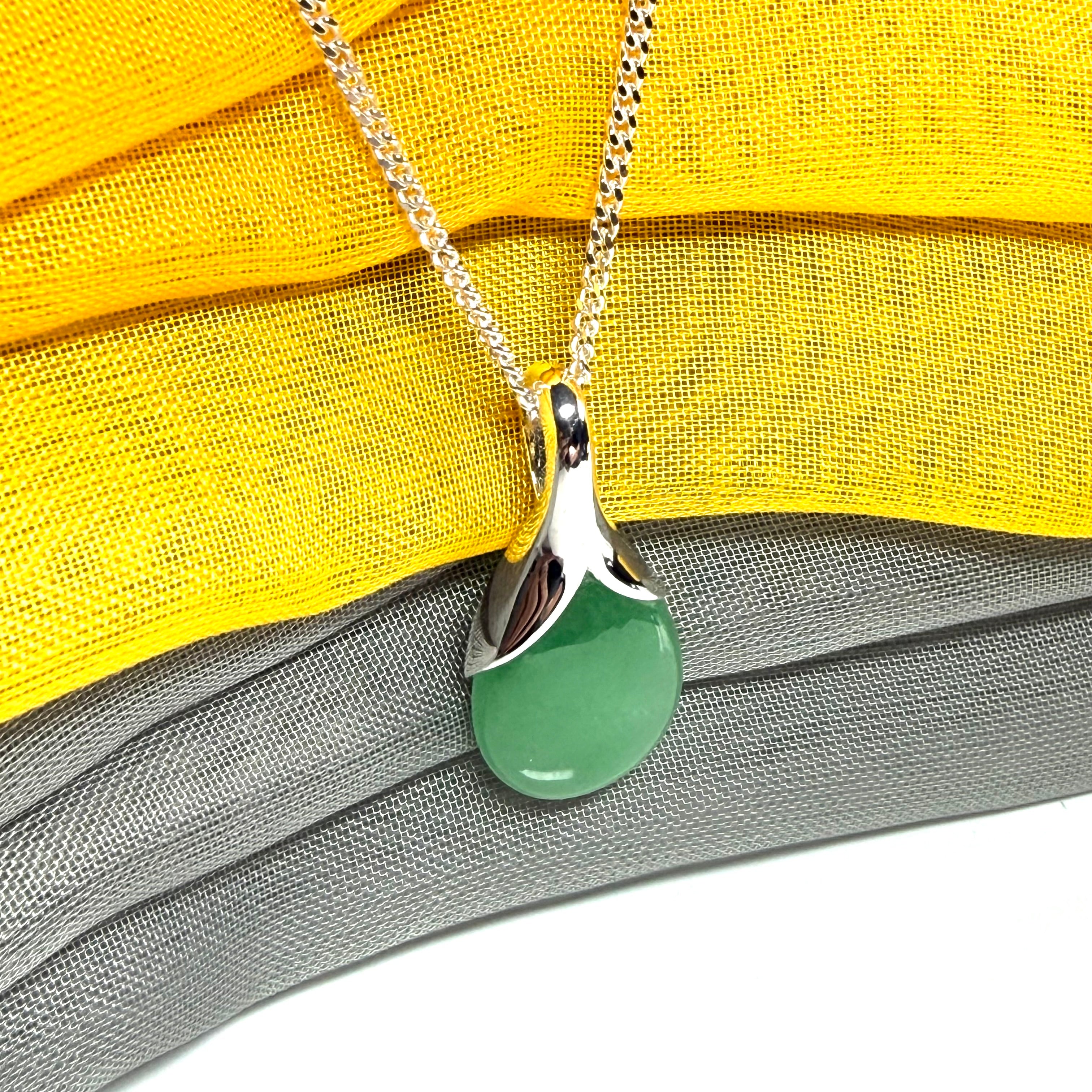 A gorgeous real green jade pendant in a teardrop or pear shape, a real ...