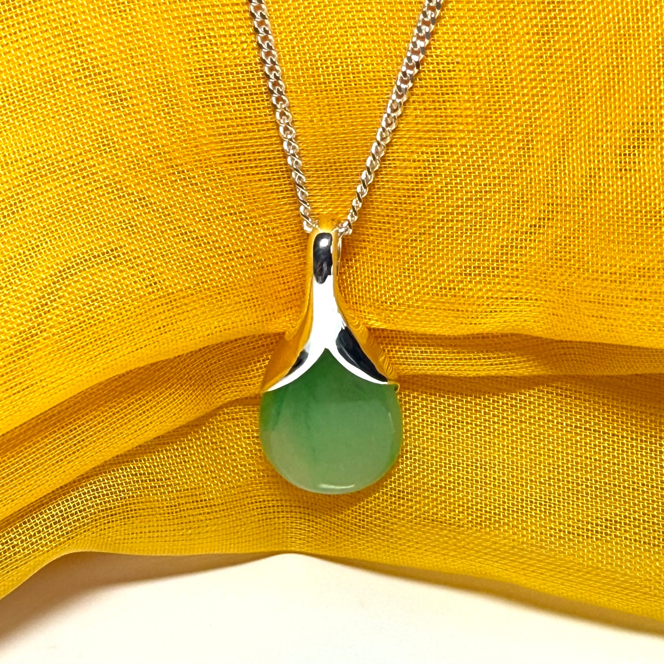 Real green jade necklace in a teardrop or pear shape, a really meaning ...