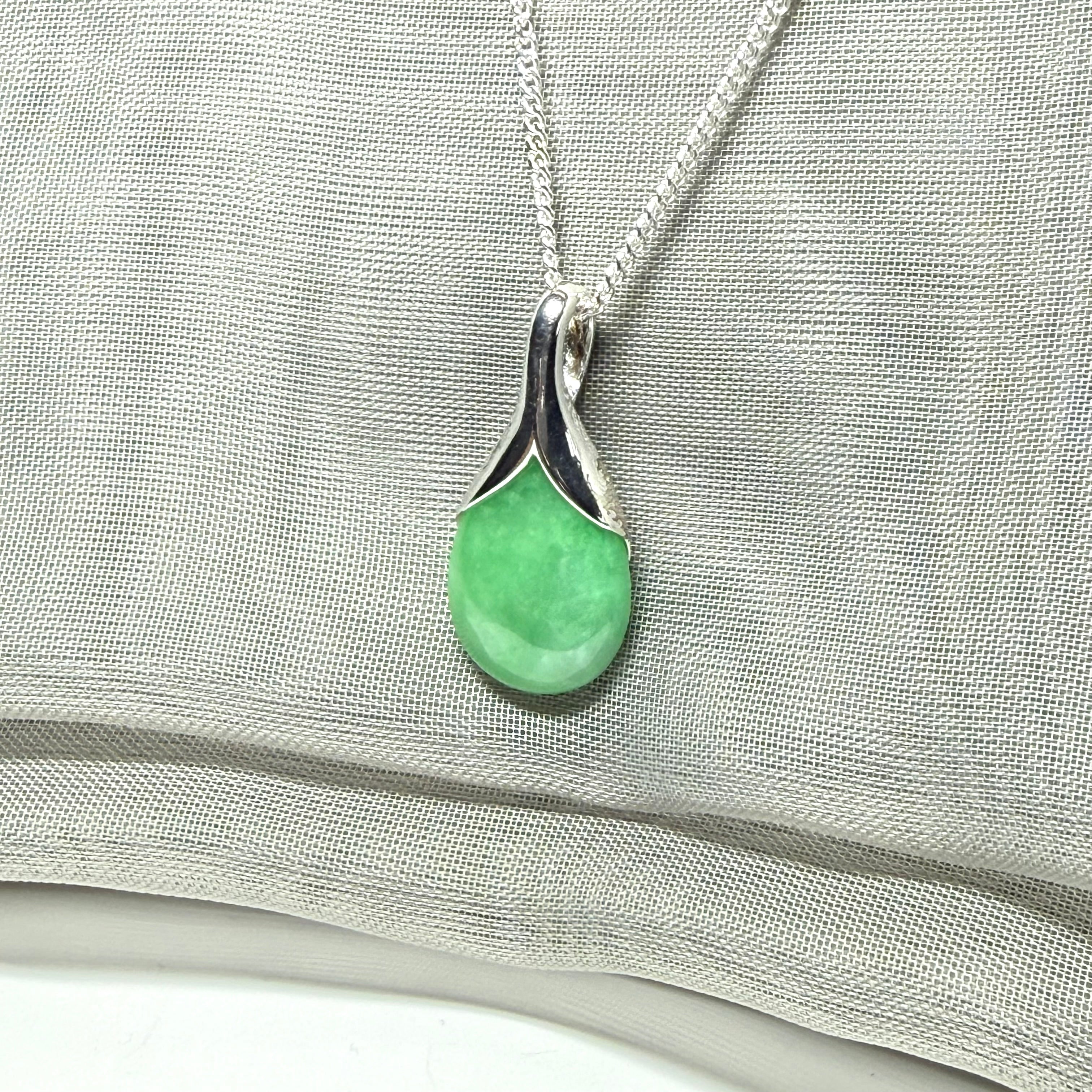 A real green jade necklace in a teardrop or pear shape, a gorgeous des ...