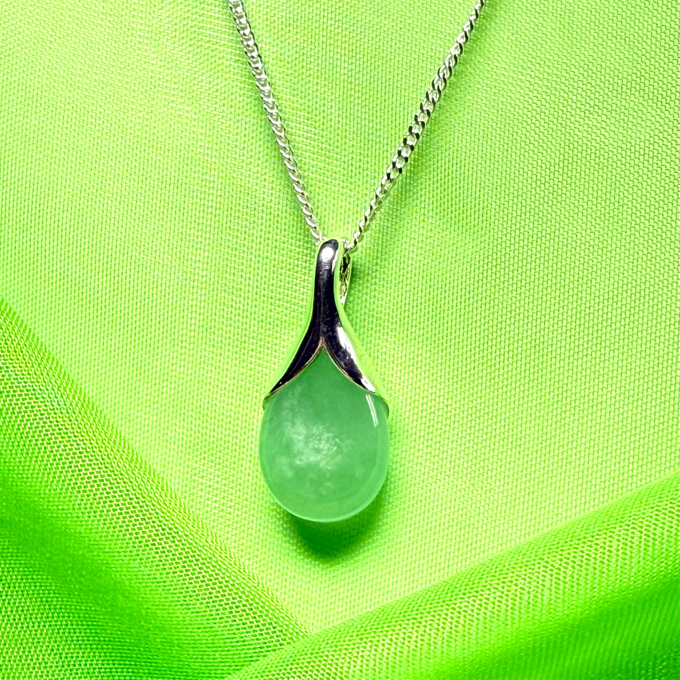 Real green jade necklace in a teardrop with pear shape, a timeless stu ...