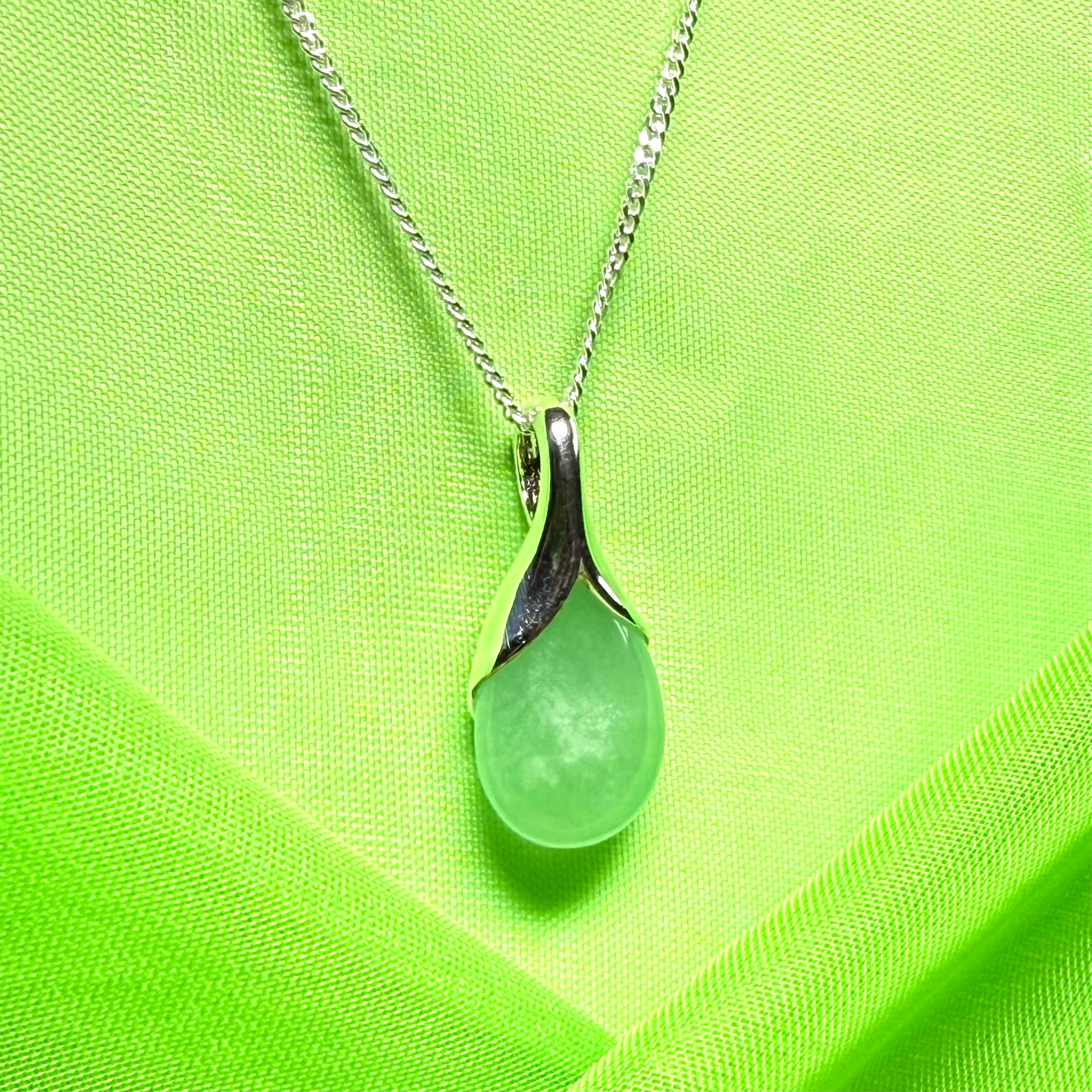 Real green jade necklace in a teardrop with pear shape, a timeless stu ...